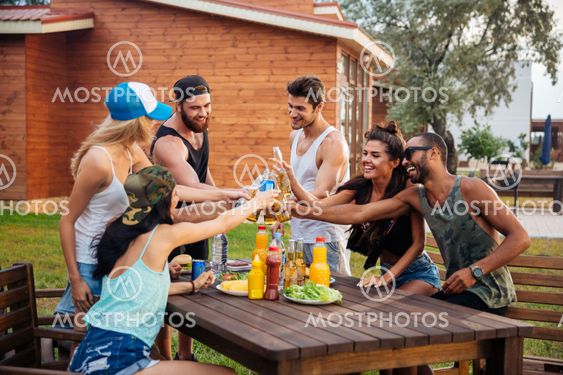 "Group of young cheerful fri..." by Dean Drobot - Mostphotos