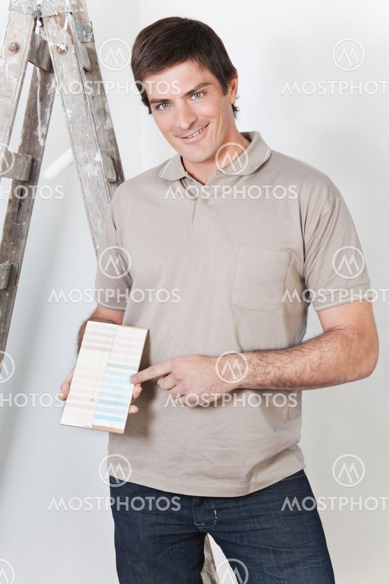 "Man pointing at color guide" by Doug Olson - Mostphotos