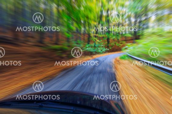 "Car driving fast into forest" av Fesus Robert - Mostphotos