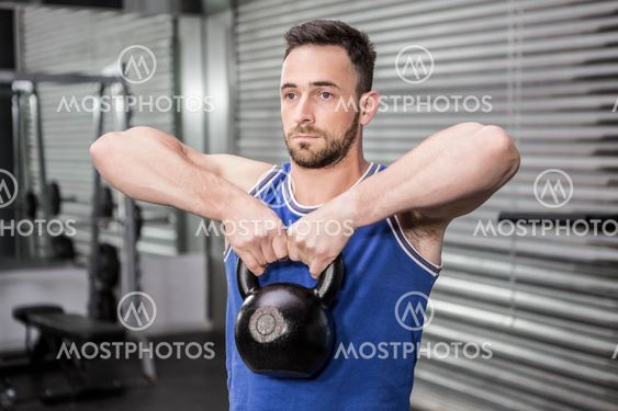 "Muscular man lifting heavy..." by Wavebreakmedia - Mostphotos